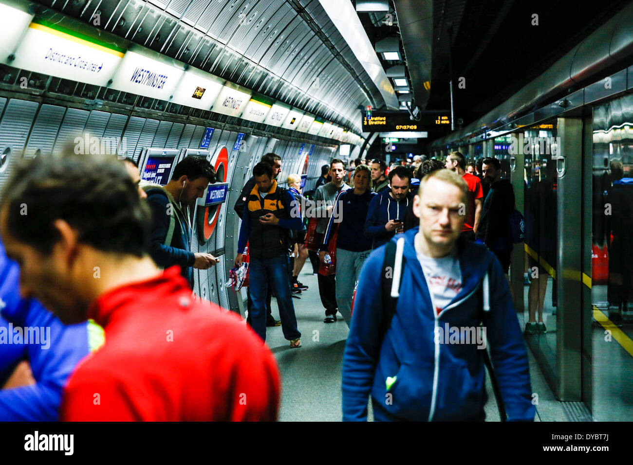 London, UK. 13th Apr, 2014. Runners crowd into the London underground ...