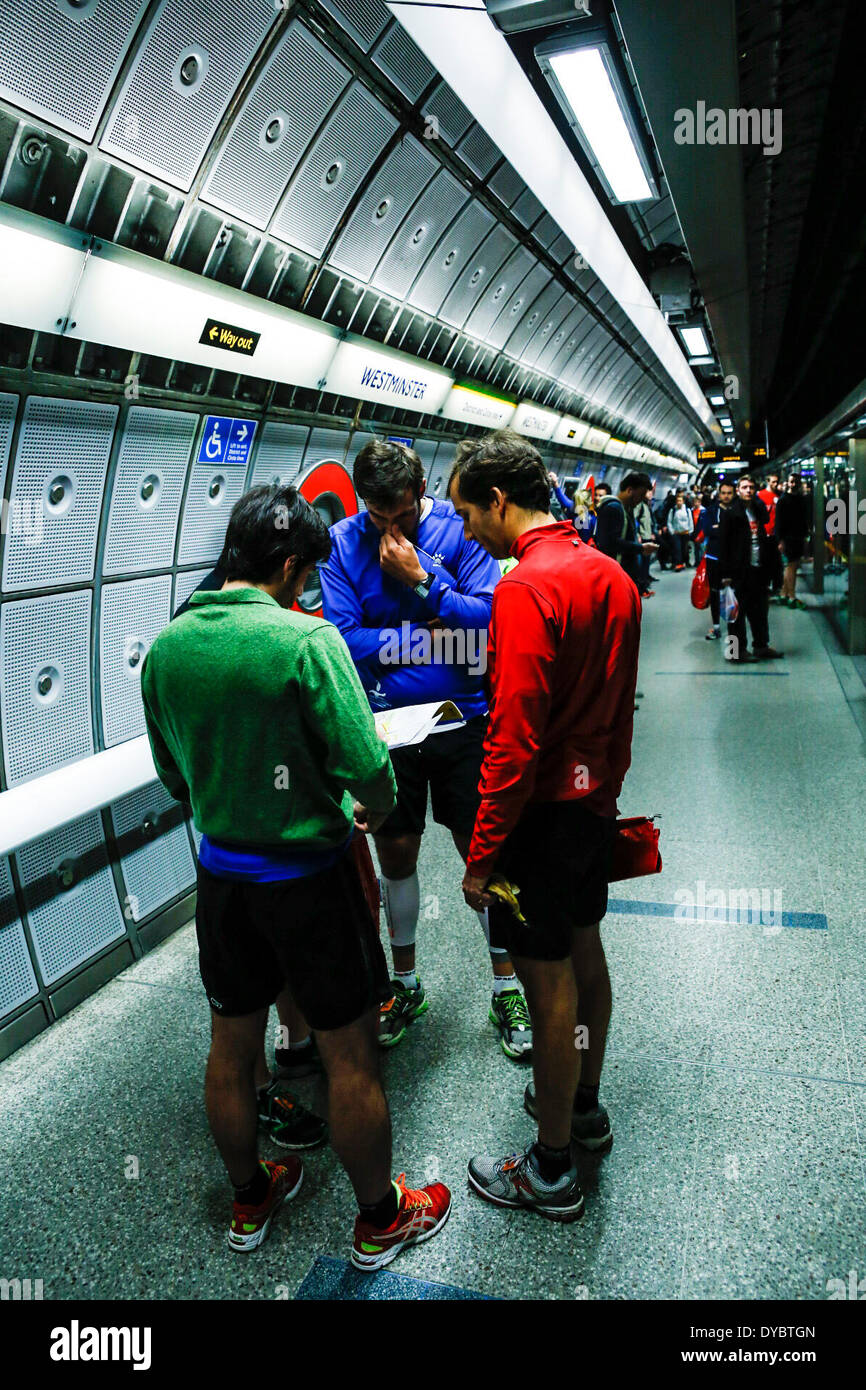 London, UK. 13th Apr, 2014. Runners crowd into the London underground ...
