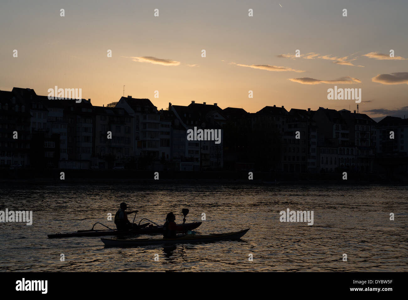 Two boats paddling on the Rhine river in Basel during sunset time Stock ...