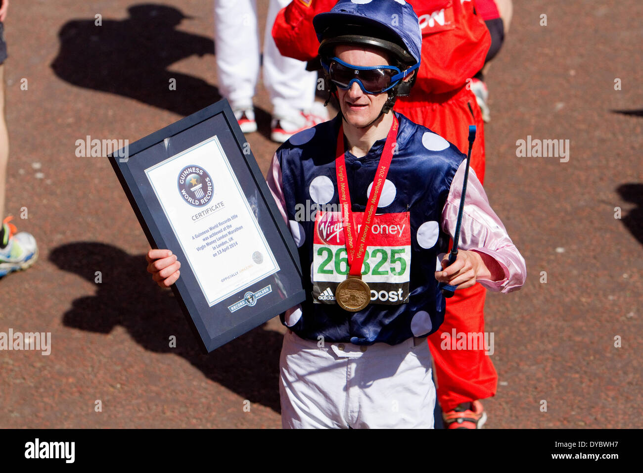 London, UK. 13th April, 2014. A male runner in a jockey outfit won a ...