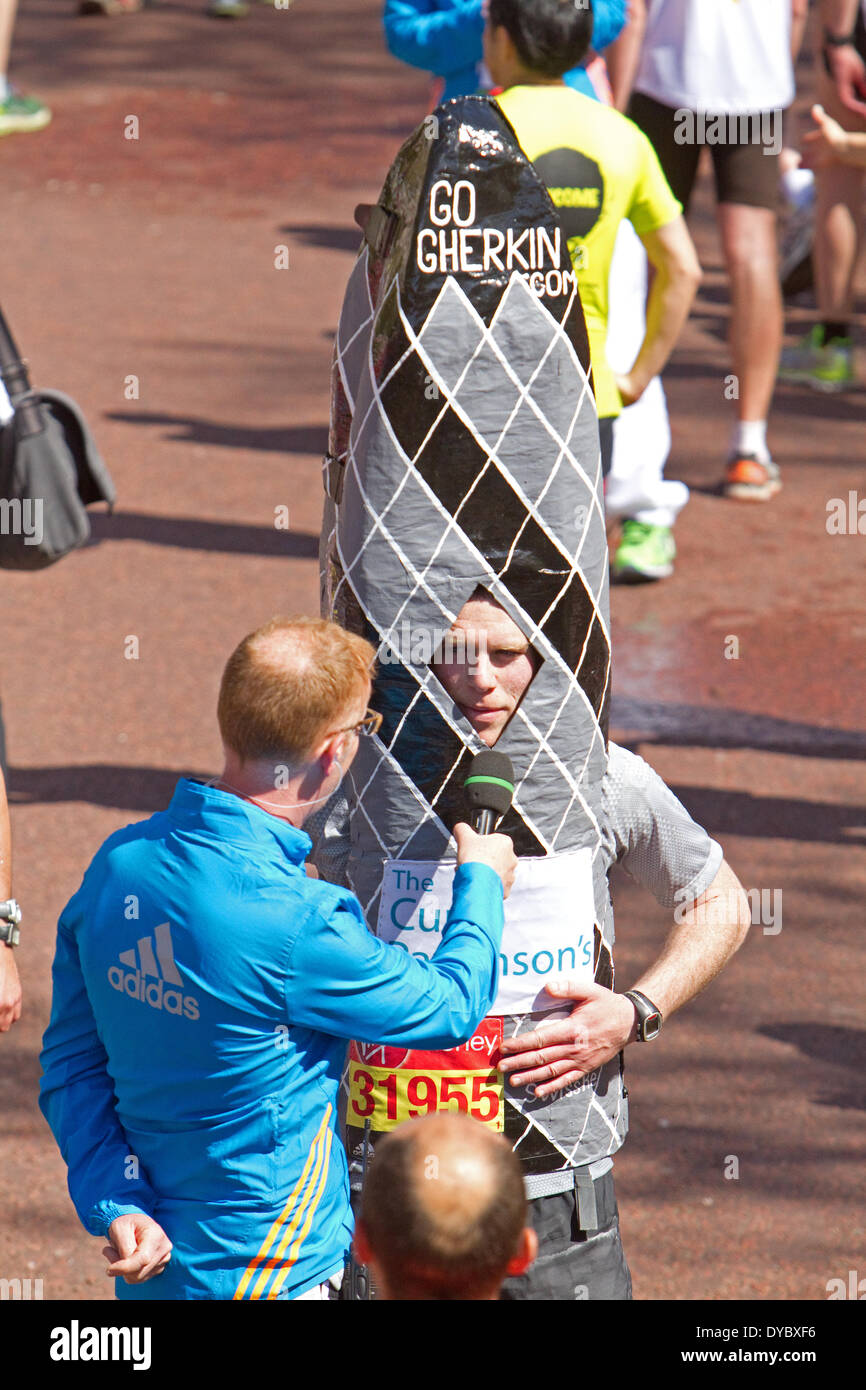London,UK,13th April 2014,A male runner dressed as the London Gherkin ...