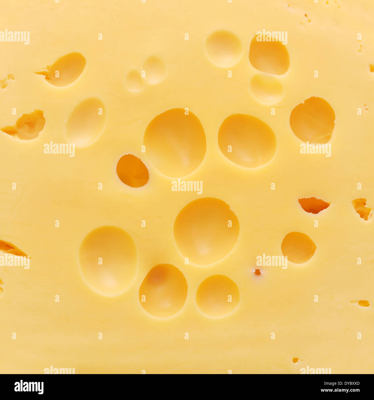 A Cheese texture with big holes closeup Stock Photo - Alamy