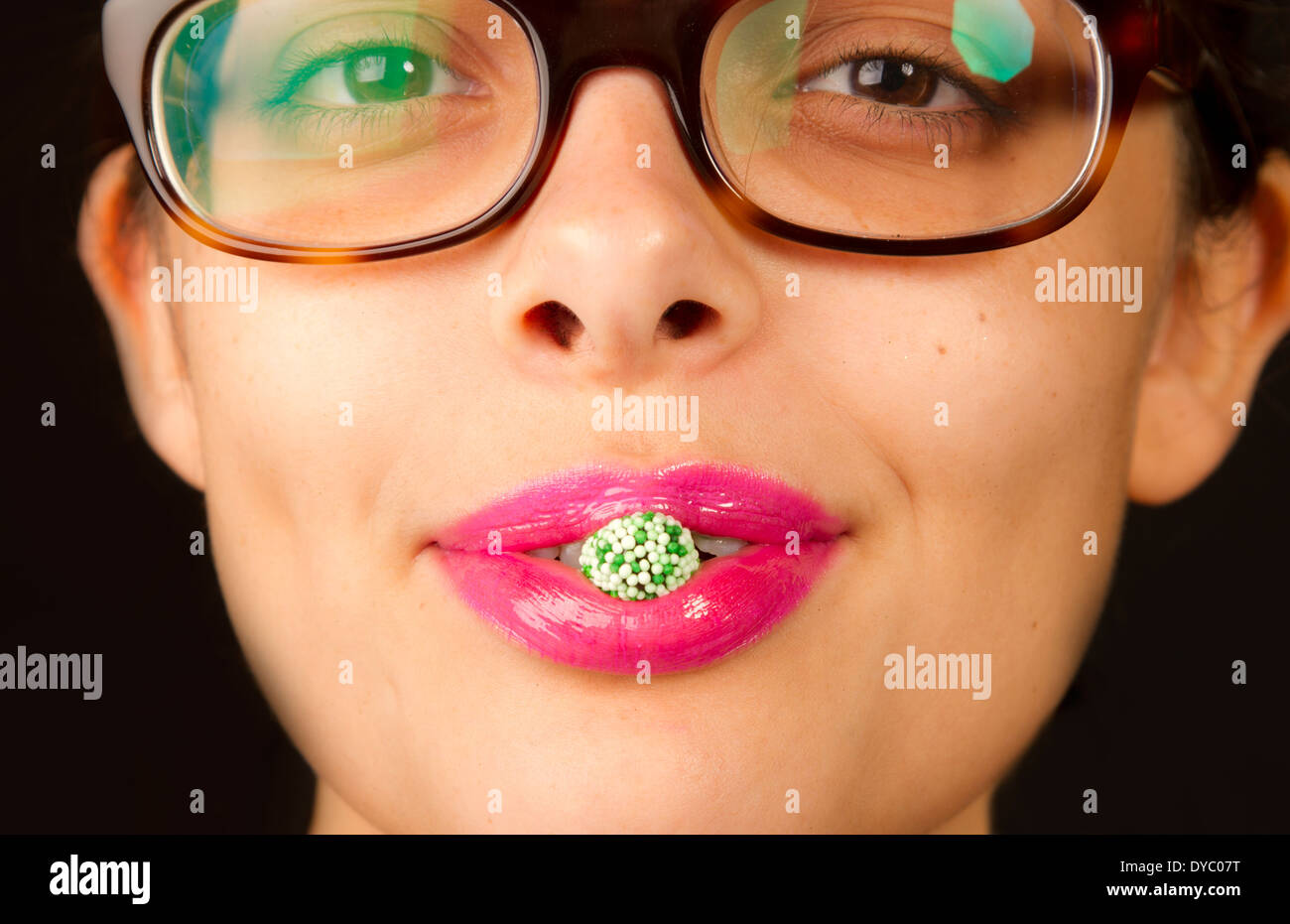 woman eating candy Stock Photo - Alamy