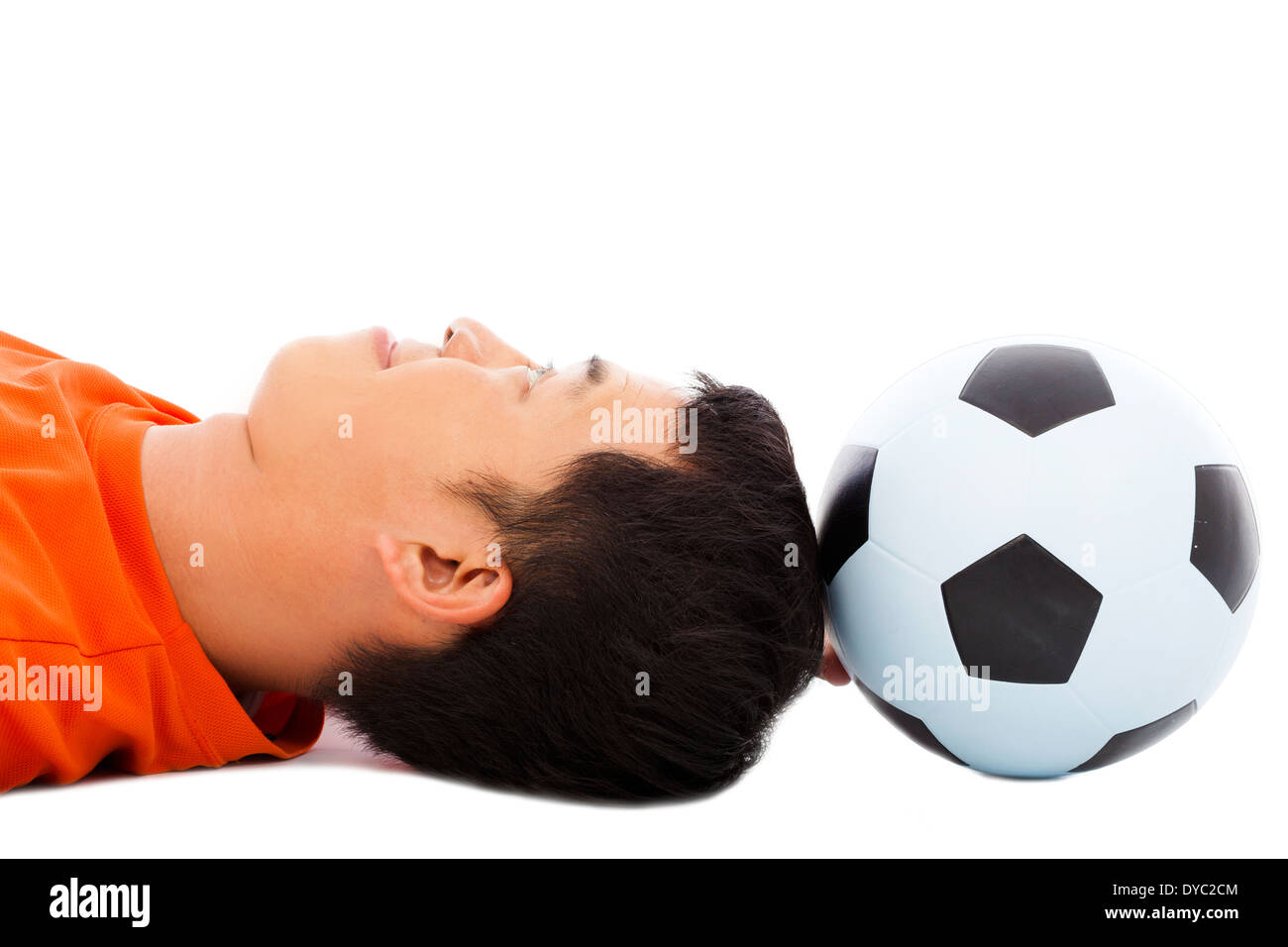 Young Man Lying Down And Thinking With Soccer over white Stock Photo ...