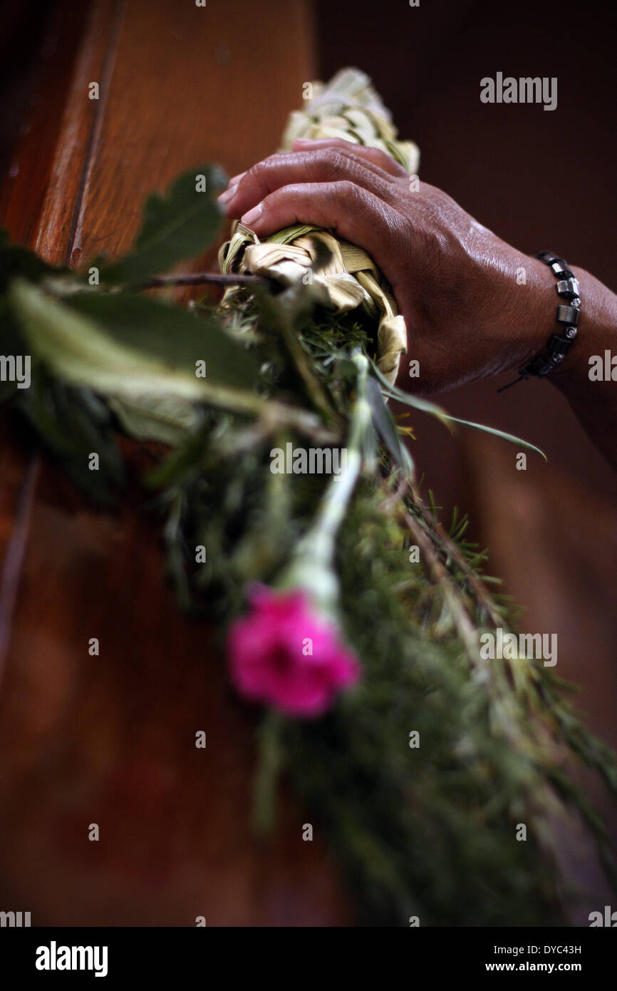 Quito, Ecuador. 13th Apr, 2014. A person attends a mass during the ...