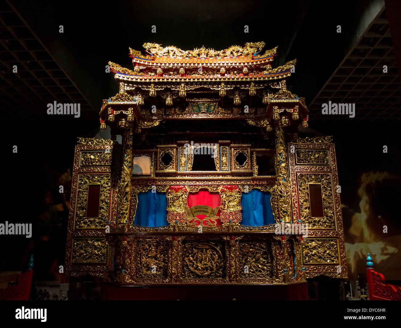 A golden puppet stage on display at the at the Puppetry Art Center of ...