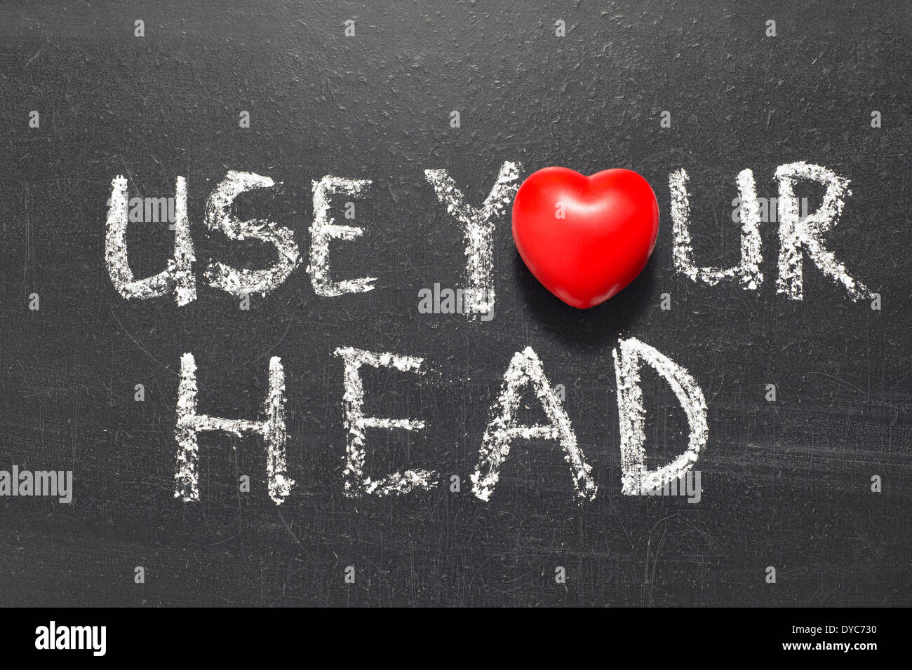 use your head phrase handwritten on blackboard Stock Photo - Alamy