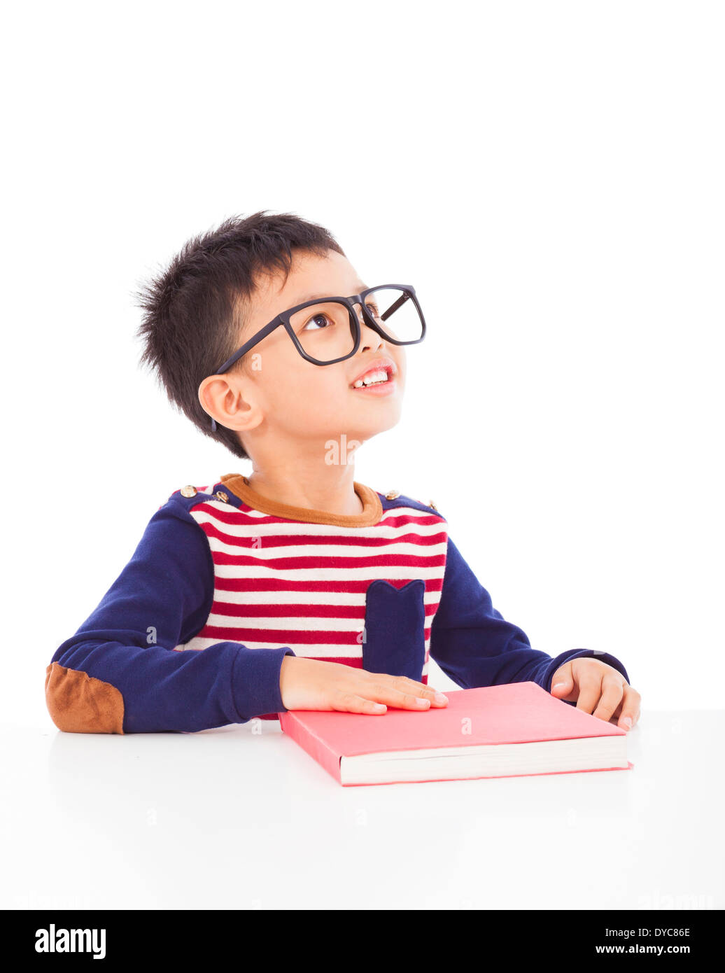 Portrait of young happy boy with book Stock Photo - Alamy