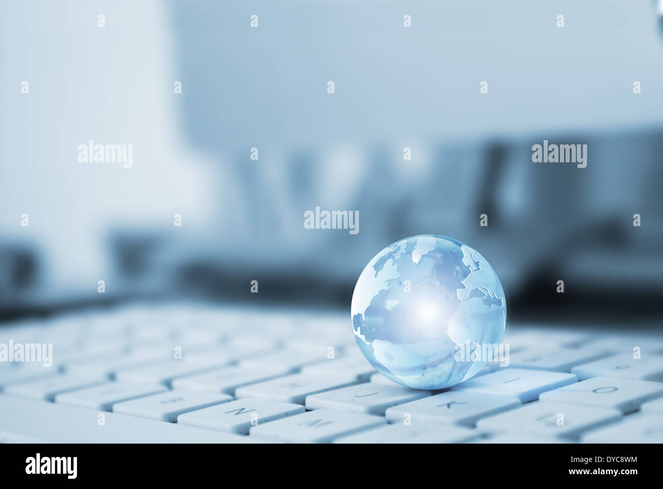 transparent globe on a keyboard Stock Photo - Alamy