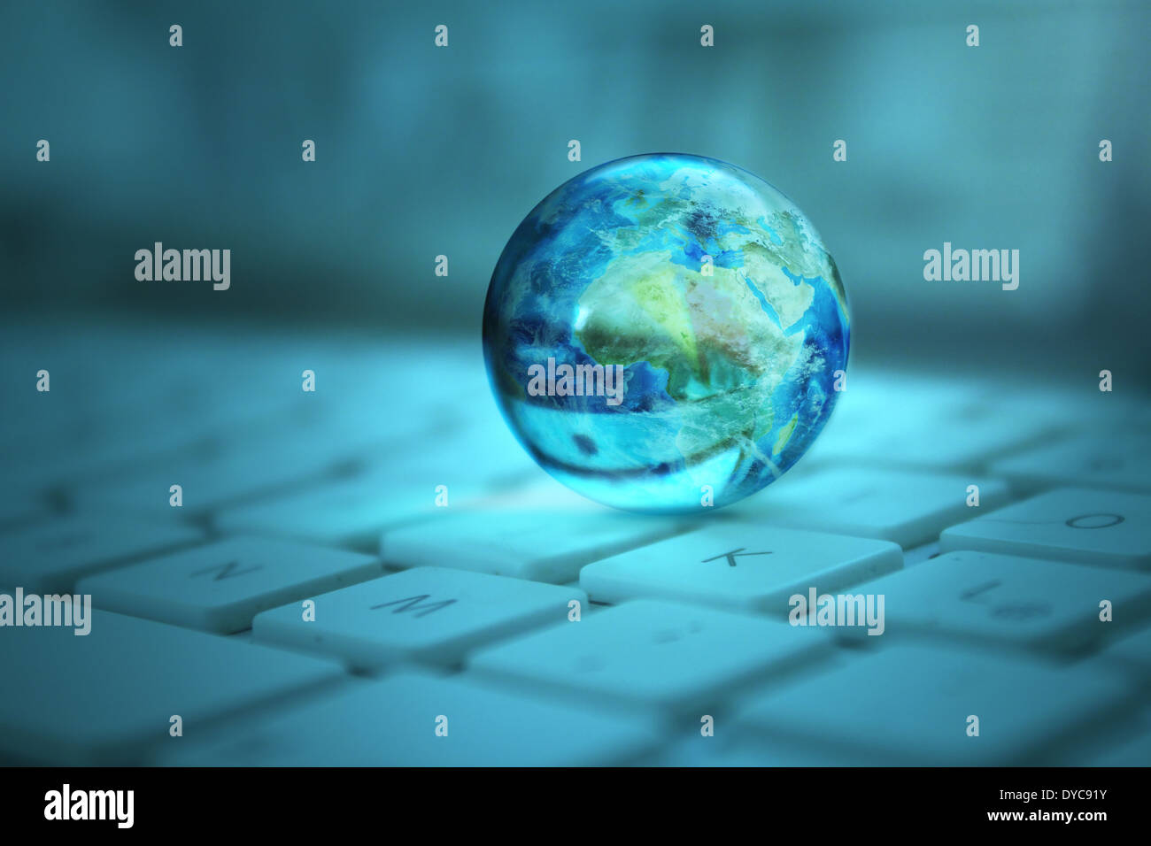 transparent globe on a keyboard Stock Photo - Alamy