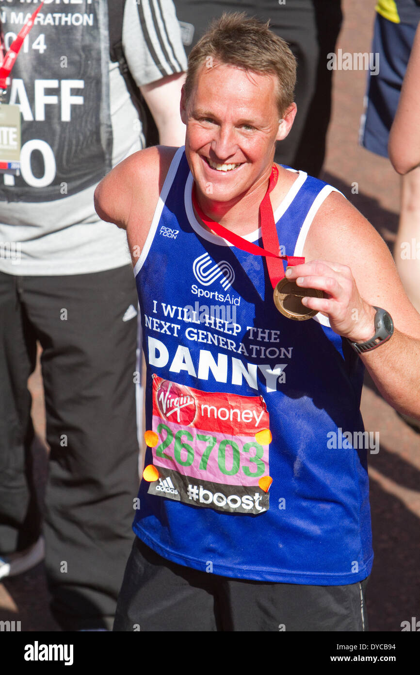 London,UK,13th April 2014,Danny Crates shows off his medal after ...
