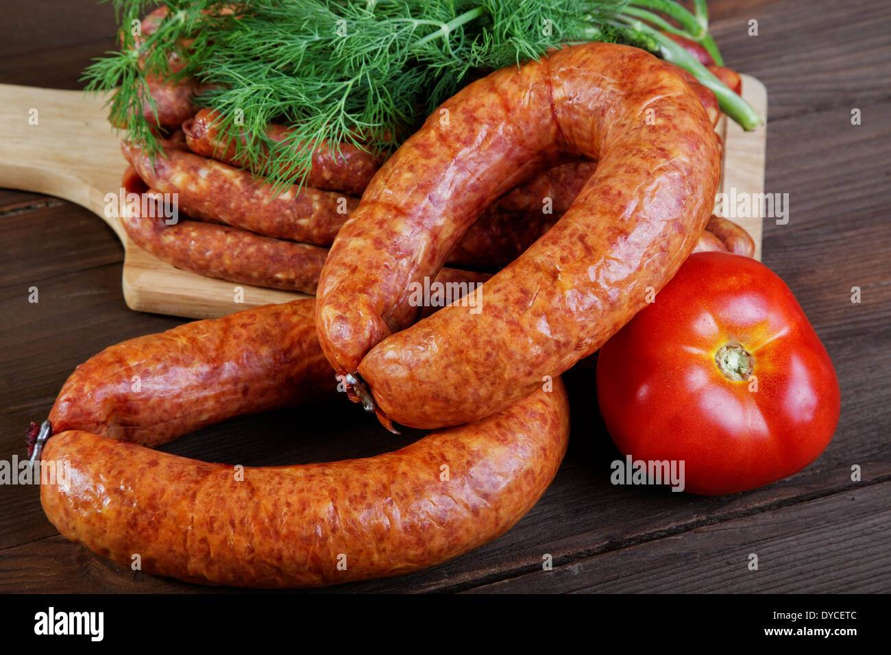 Smoked sausage on a kitchen table Stock Photo - Alamy