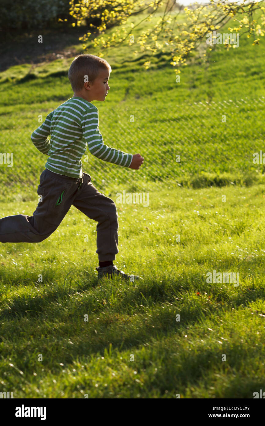 Boy running hi-res stock photography and images - Alamy