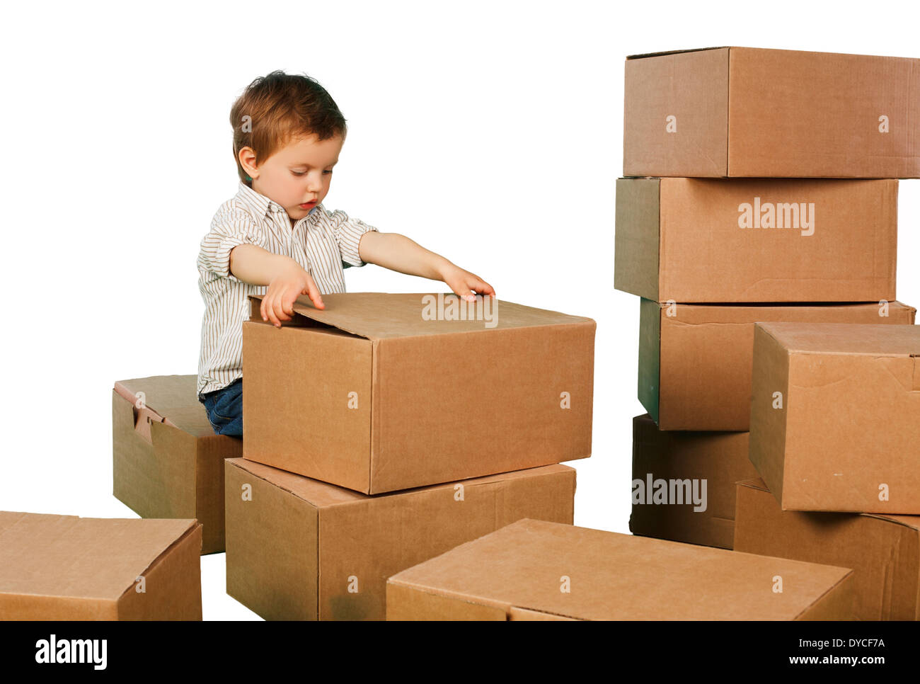 little boy plays in boxes Stock Photo - Alamy