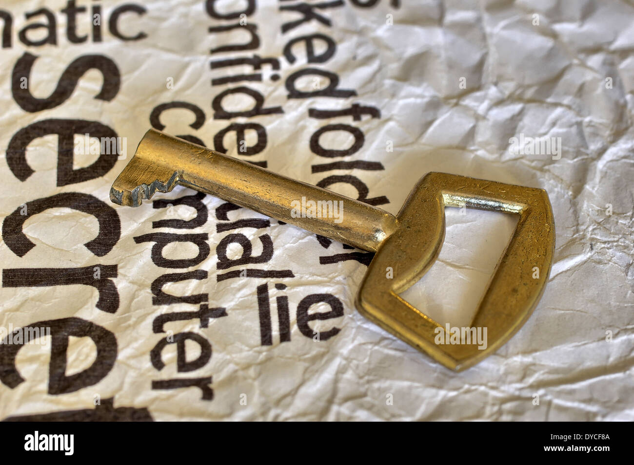 Golden key on lie Stock Photo - Alamy