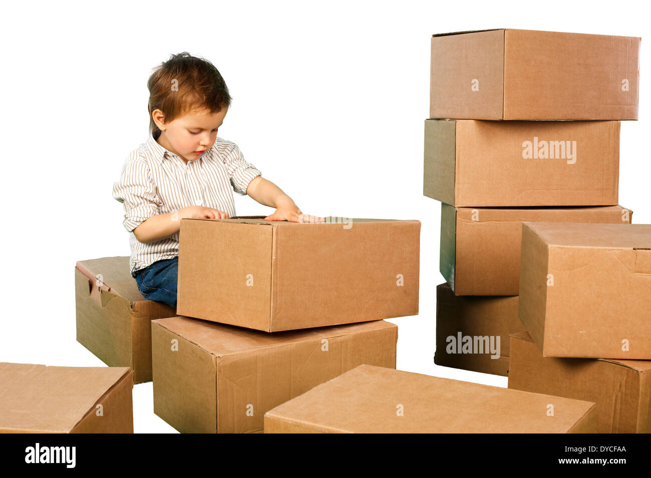 little boy plays in boxes Stock Photo - Alamy