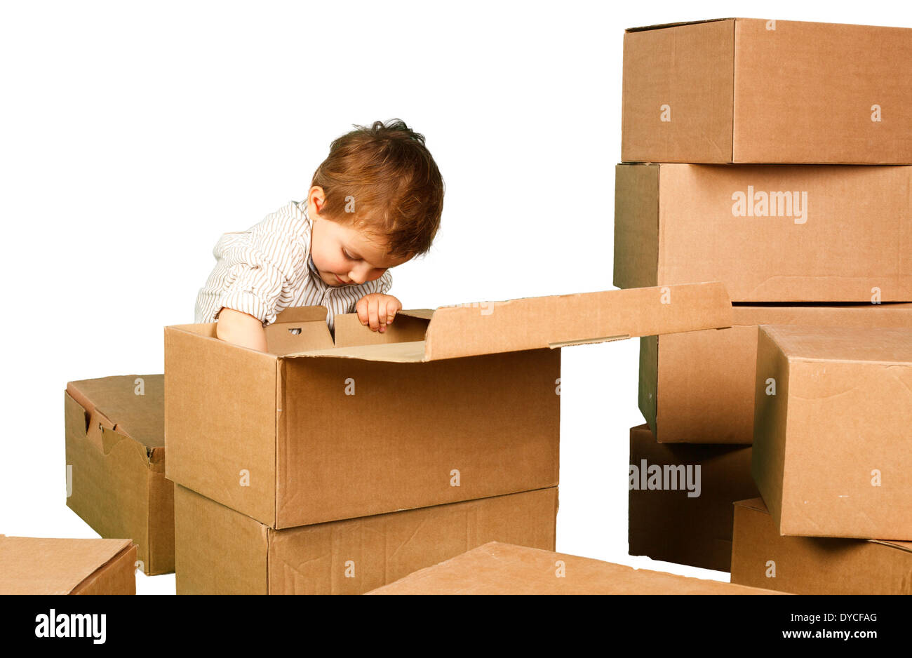 little boy plays in boxes Stock Photo - Alamy
