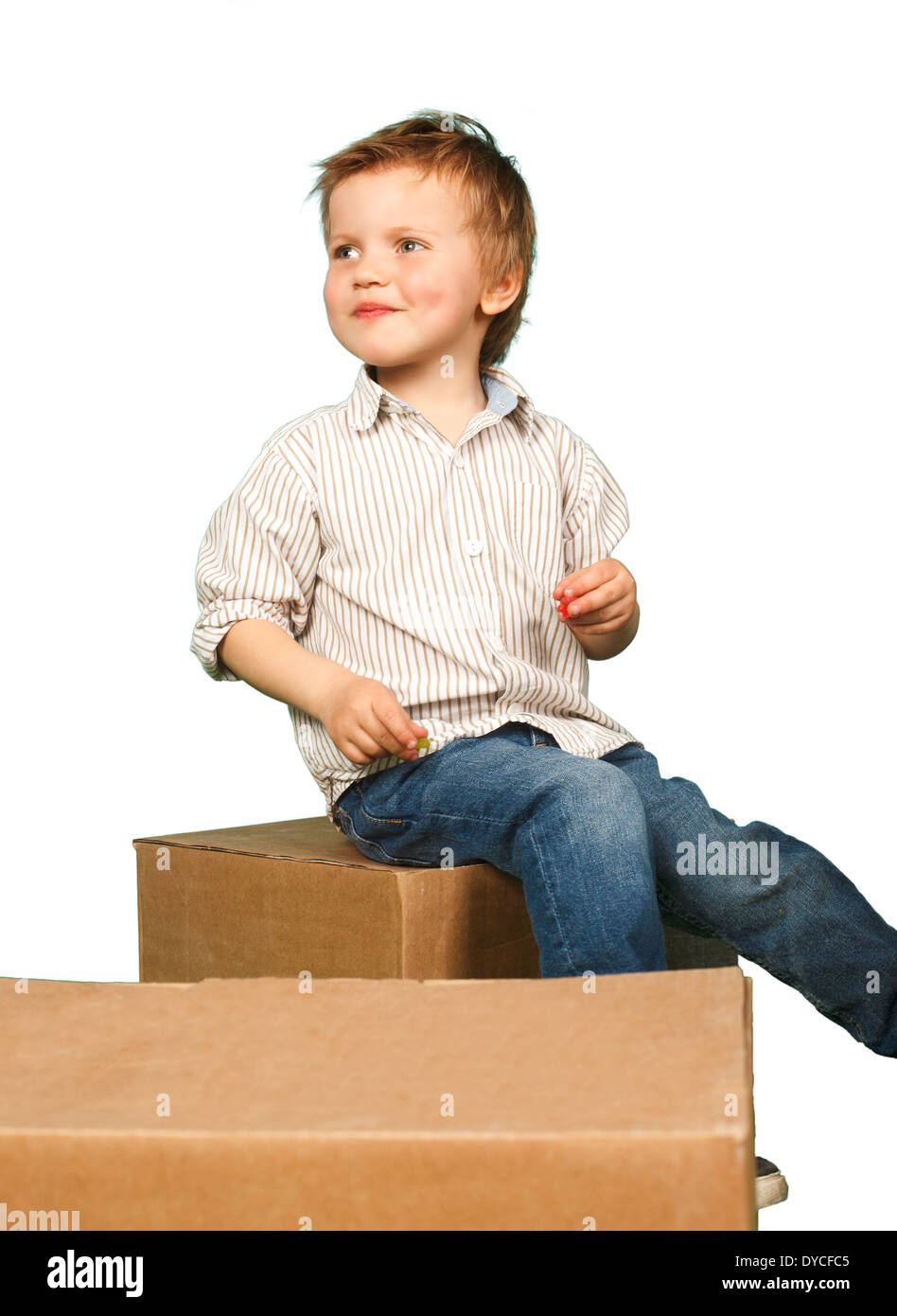 little boy plays in boxes Stock Photo - Alamy