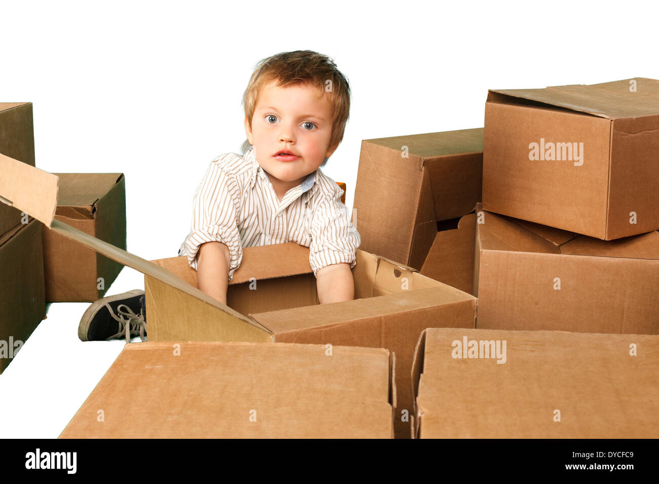 little boy plays in boxes Stock Photo - Alamy