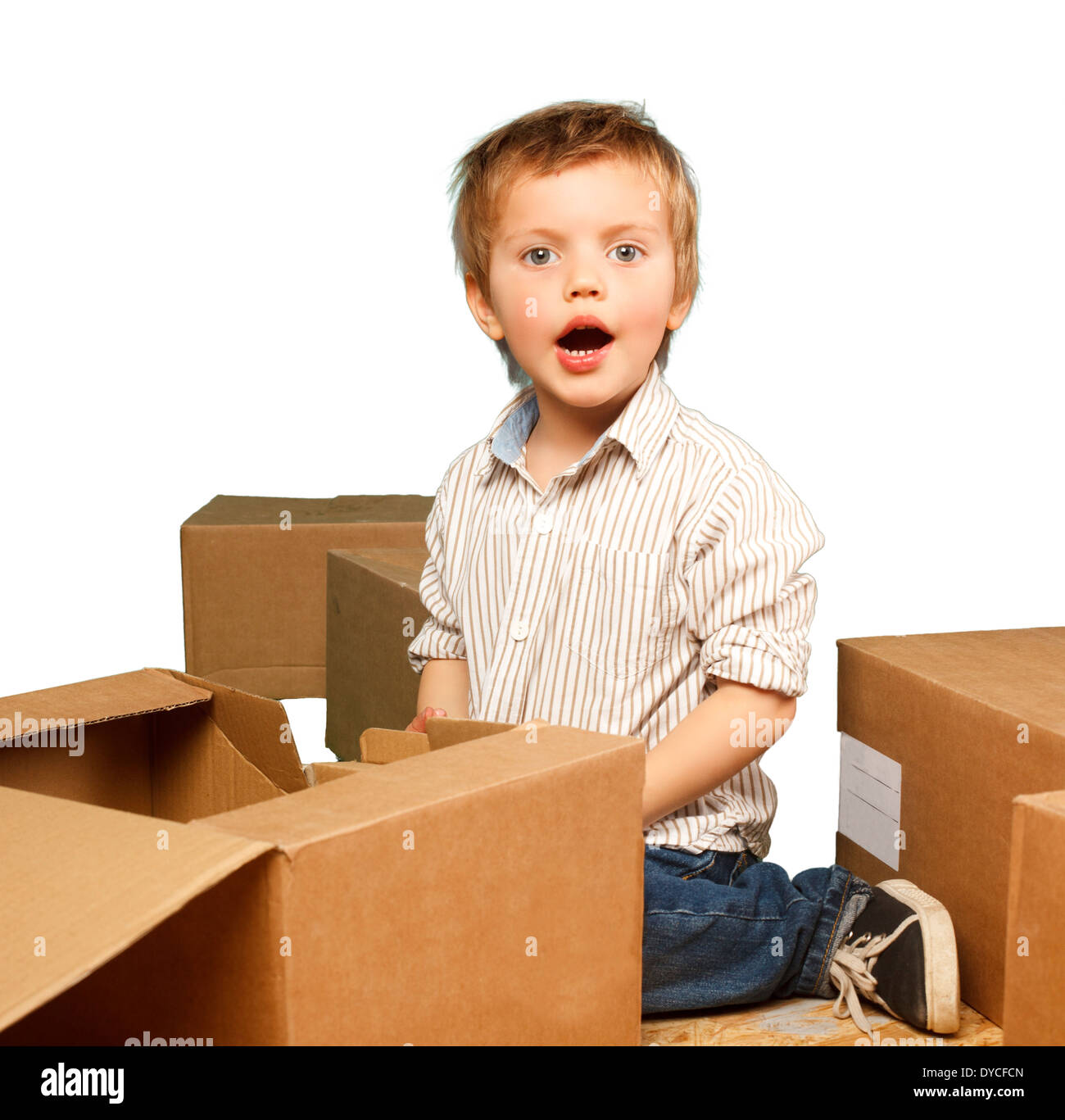 little boy plays in boxes Stock Photo - Alamy