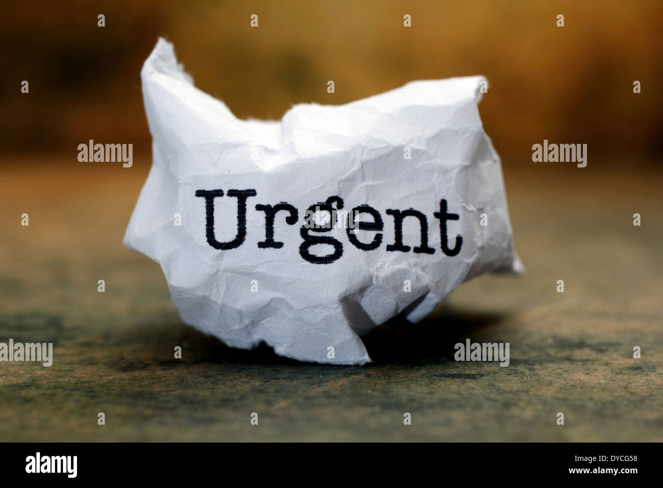 Urgent text on paper Stock Photo - Alamy