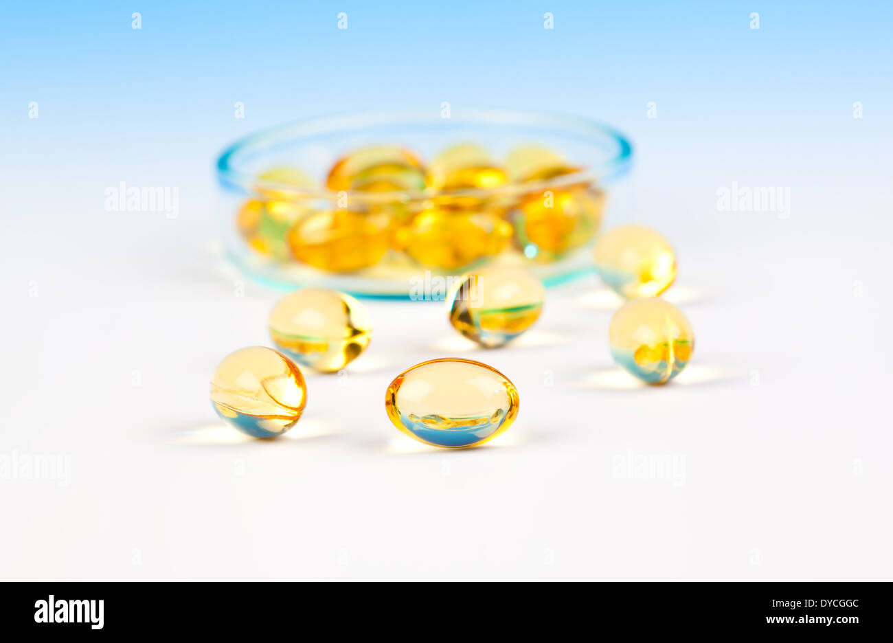 Golden oil capsules hi-res stock photography and images - Alamy