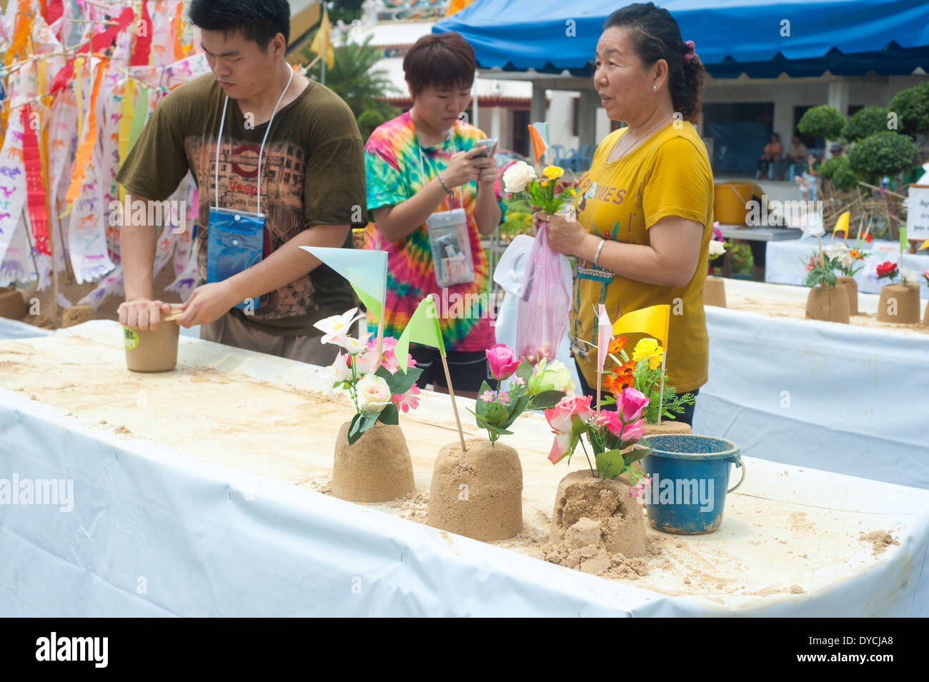 Bangkok, Thailand - Songkran festival, people build sand pagodas inside ...