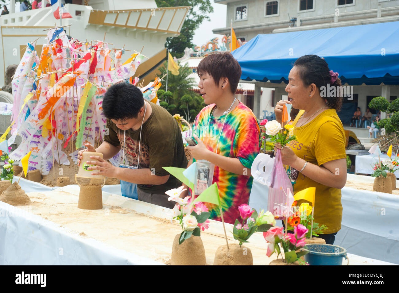 Bangkok, Thailand - Songkran festival, people build sand pagodas inside ...