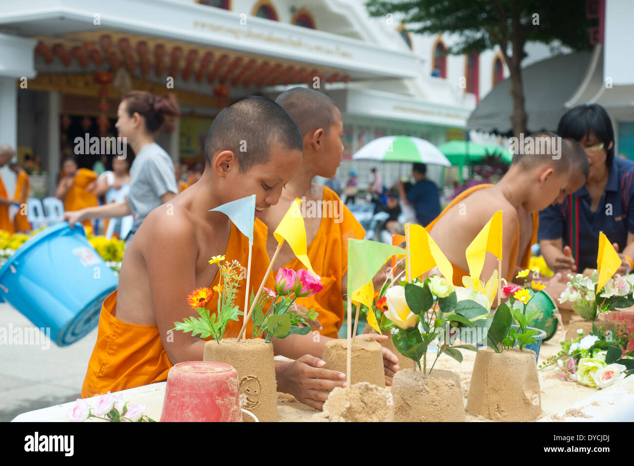 Bangkok, Thailand - Songkran festival, novice monks build sand pagodas ...