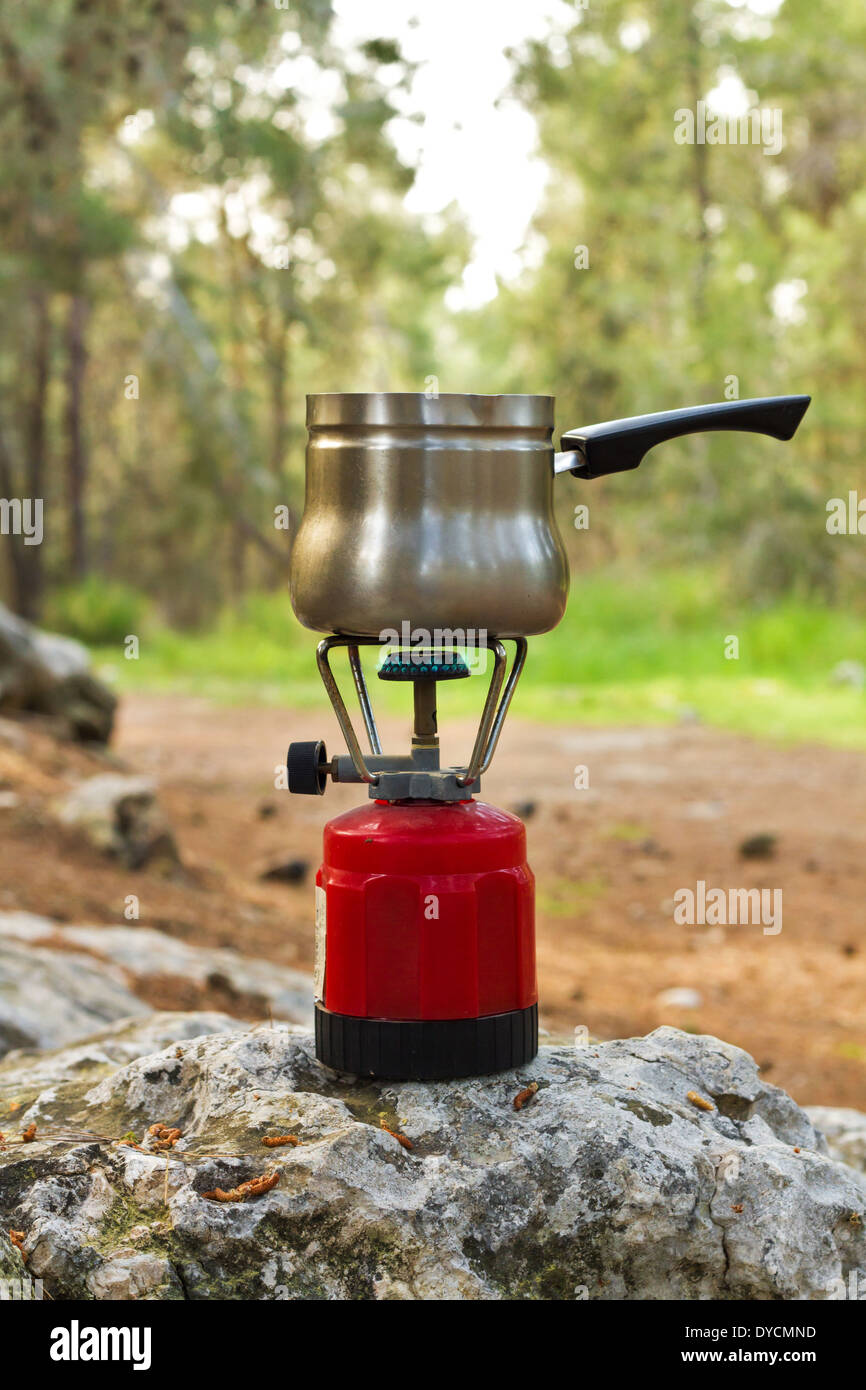 Making coffee on a gas burner on the nature Stock Photo - Alamy