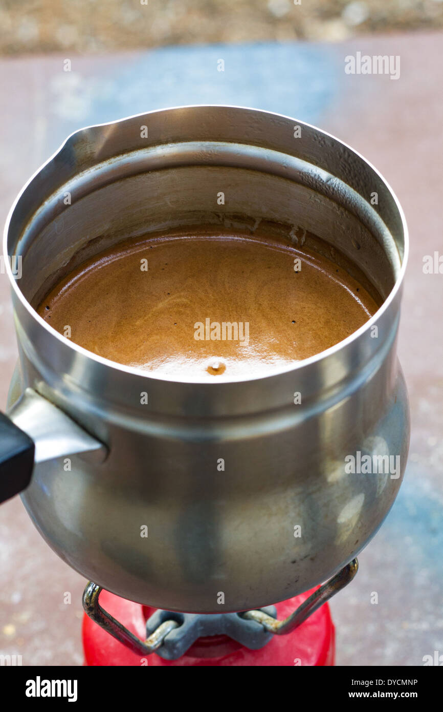 Making coffee on a gas burner on the nature Stock Photo - Alamy