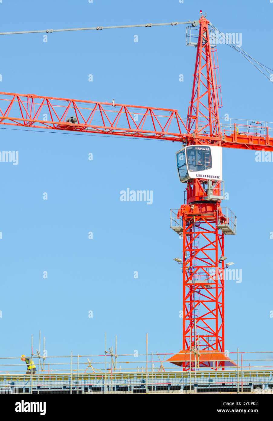 Liebherr Litronic red tower crane showing the crane driver's cabin ...