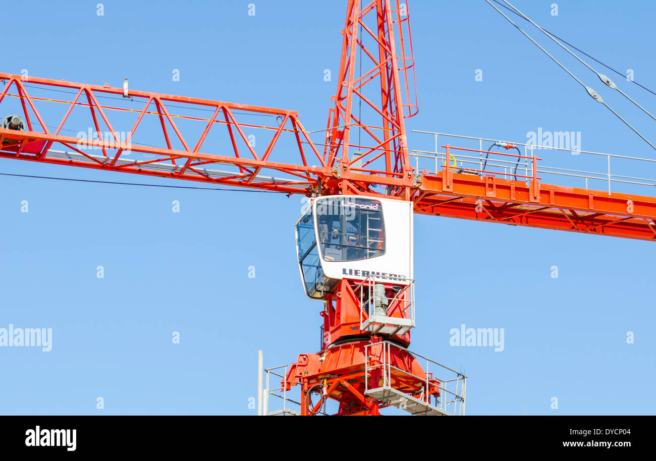 Liebherr Litronic red tower crane showing the crane driver's cabin ...