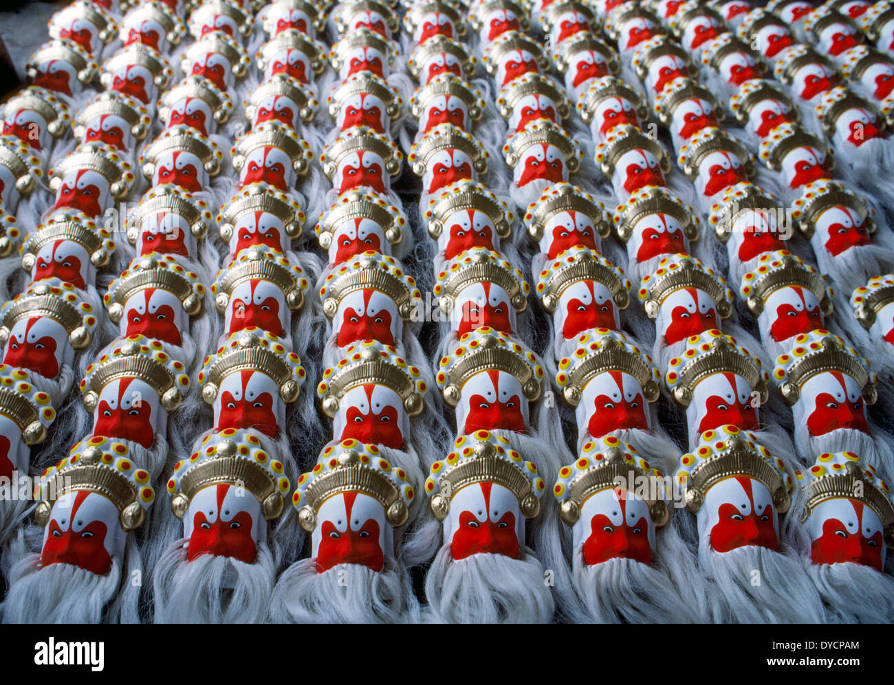 Clay figurines with hand-painted red faces and white fiber beards are ...