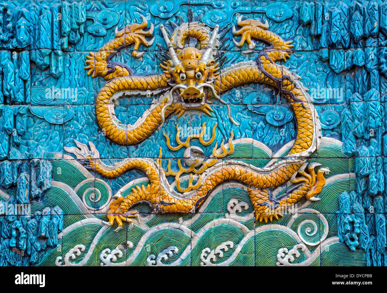 A close-up of a dragon composed of color-glazed tiles on the Nine ...