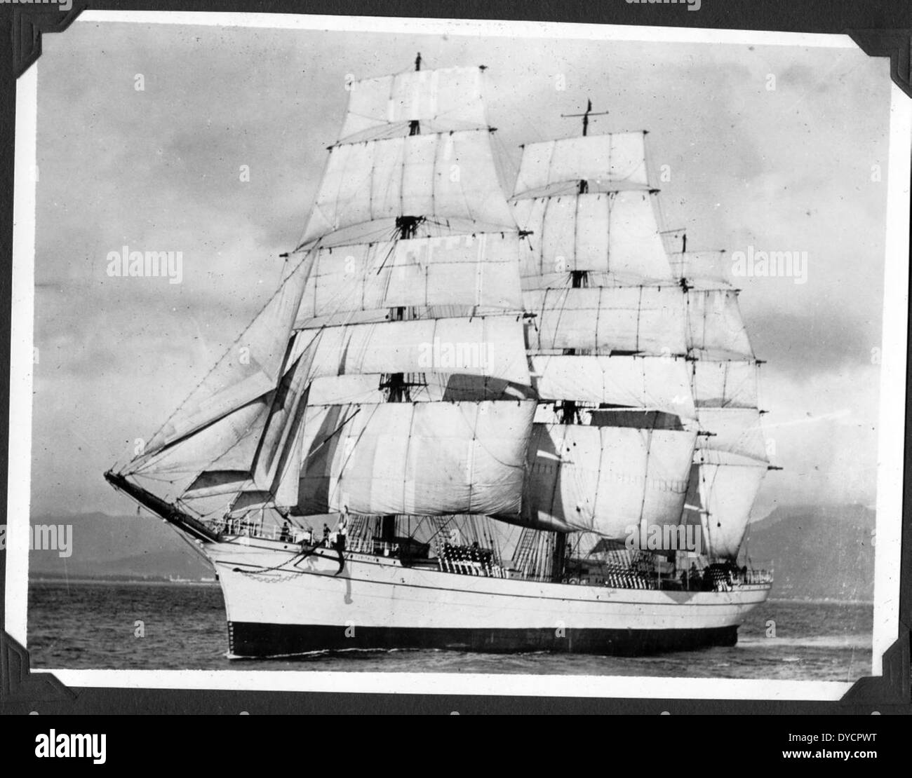 This image captures a sailing ship off the coast of Honolulu, with the ...