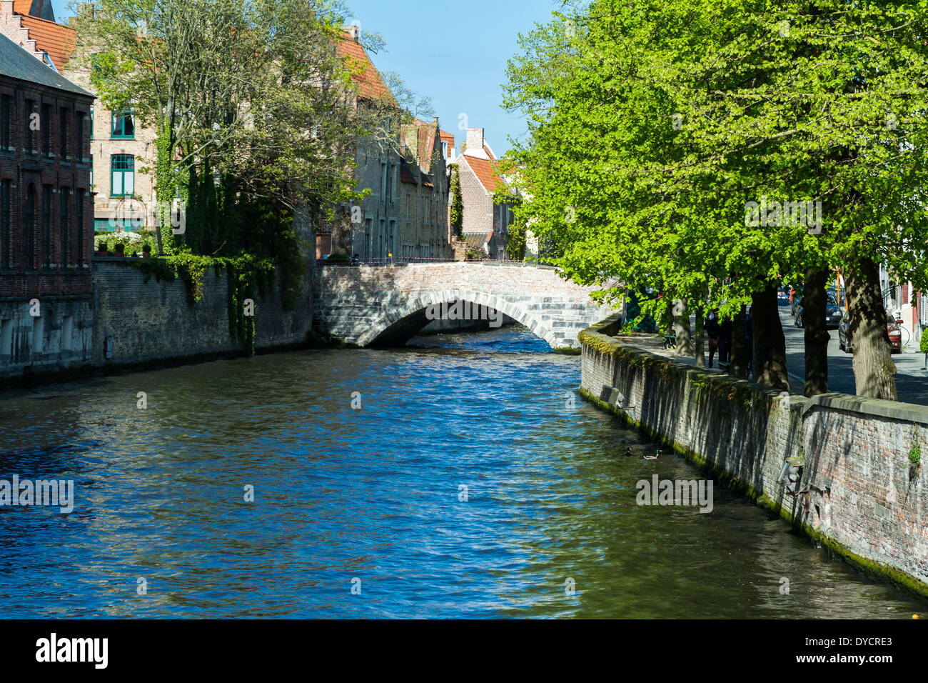 a stone bridge in the middle of a bridge on a beautiful Sunday Stock ...