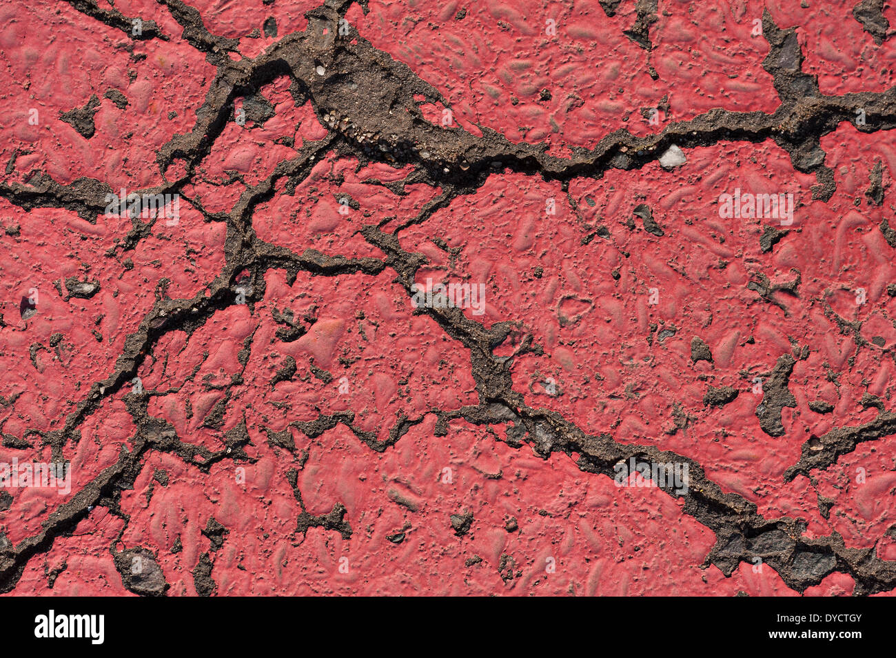 asphalt painted red for warning and heat of strong sunlight has caused ...