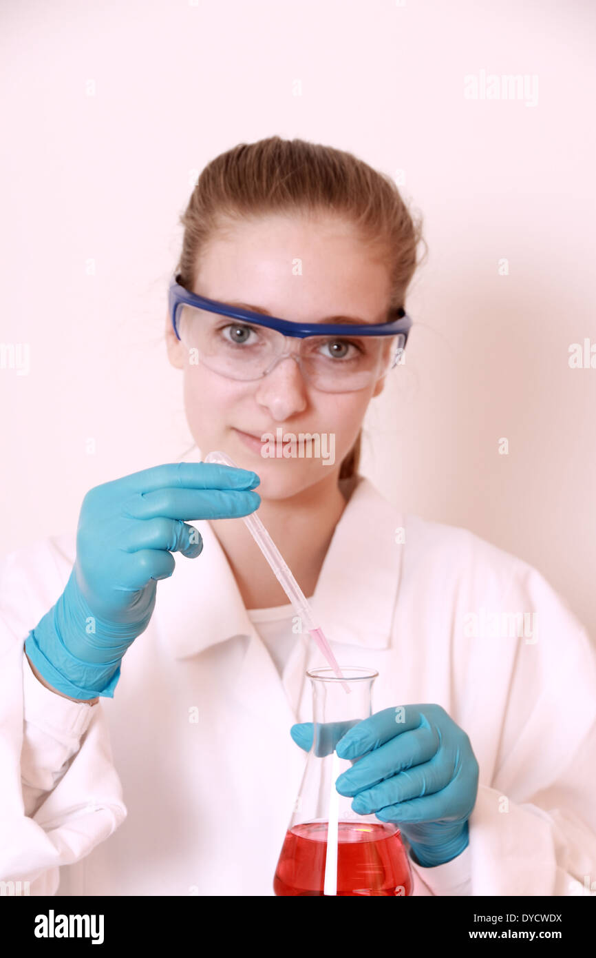 Cute girl student takes test sample, close up Stock Photo - Alamy