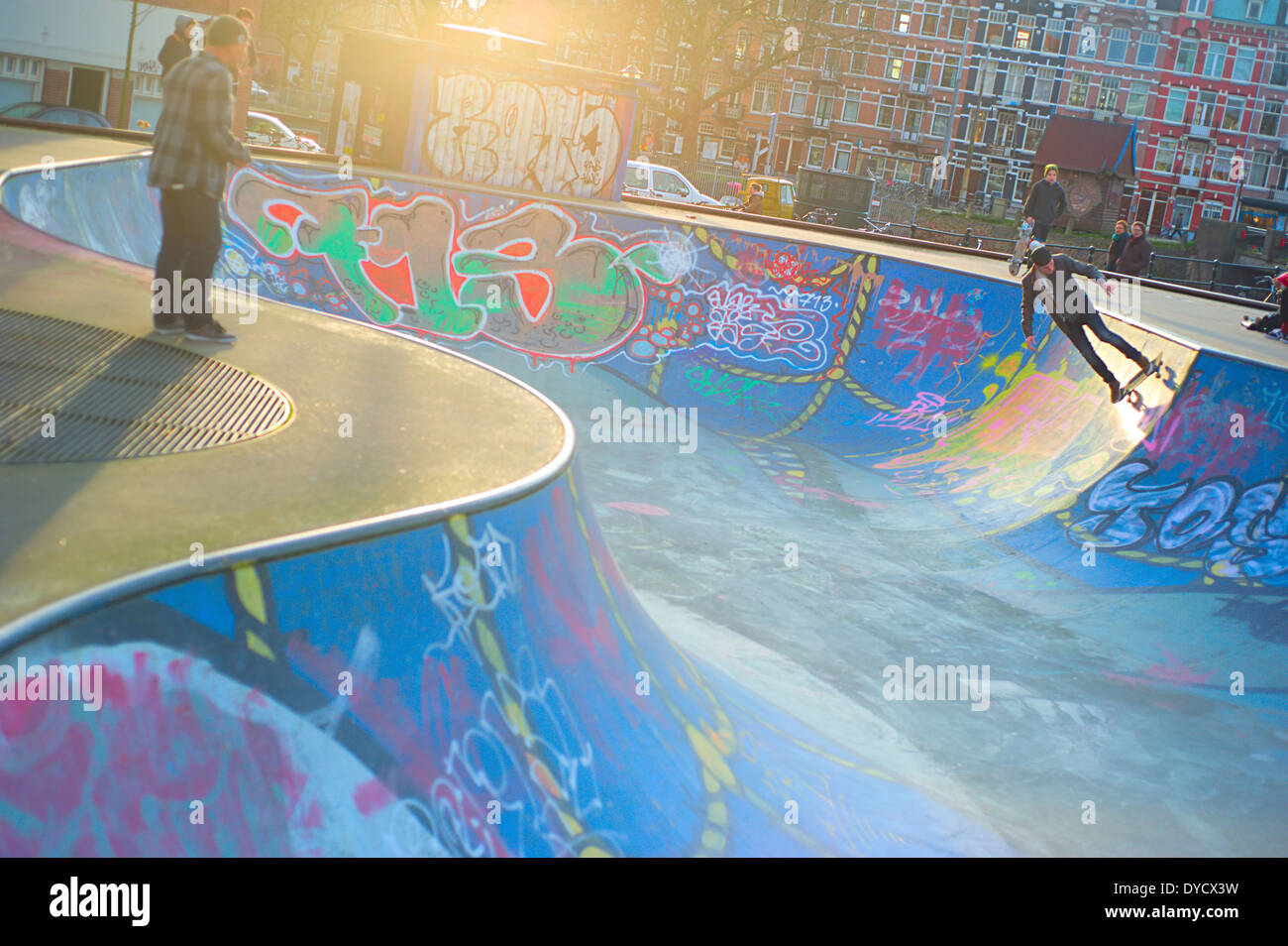 Local skaters are training on a skate ground in Amsterdam on a warm ...