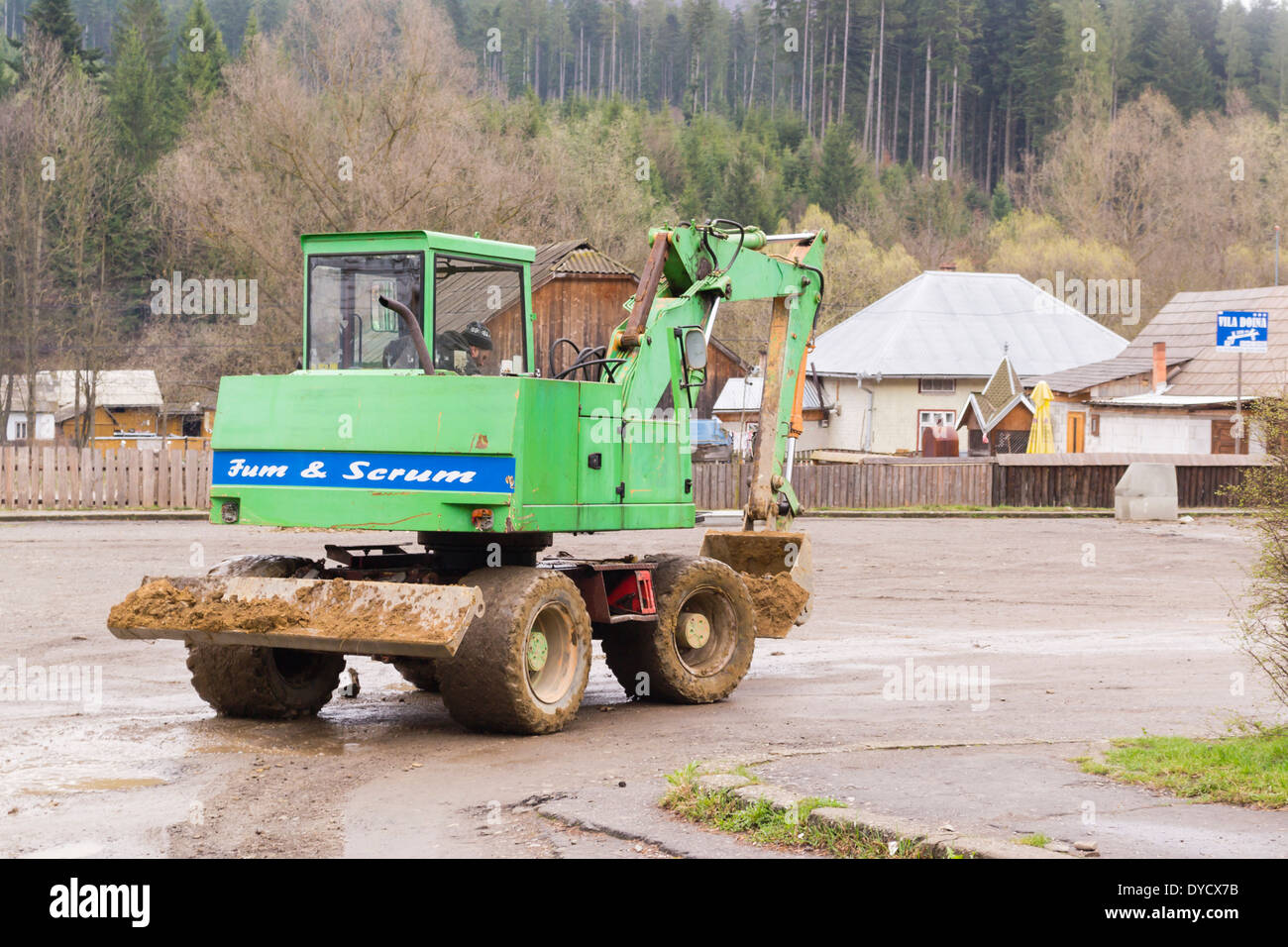 Green excavator hi-res stock photography and images - Alamy