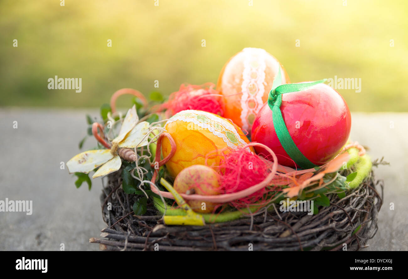 decorative easter eggs in the garden handmade Stock Photo - Alamy