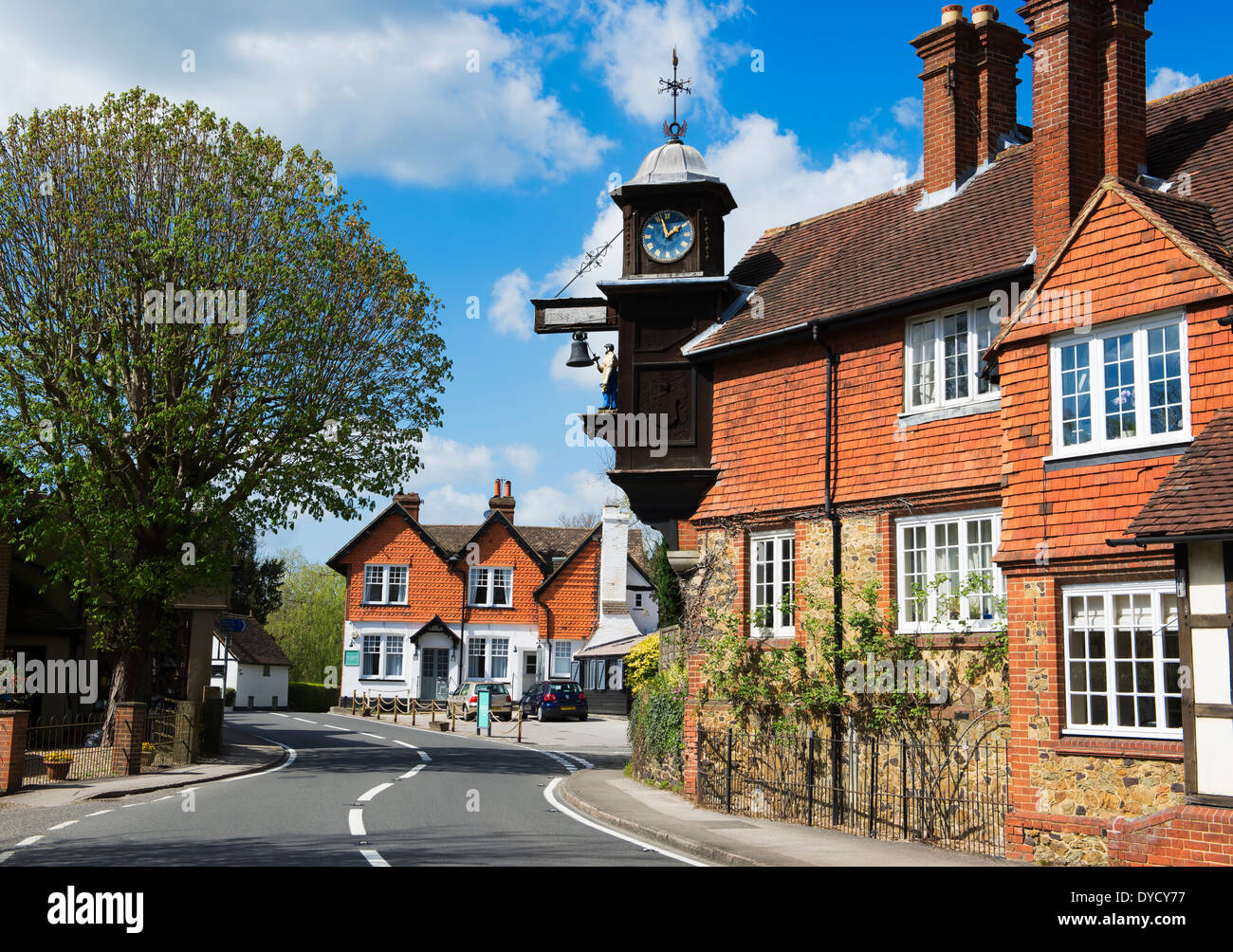 The historic village clock overhangs the main road through the village ...
