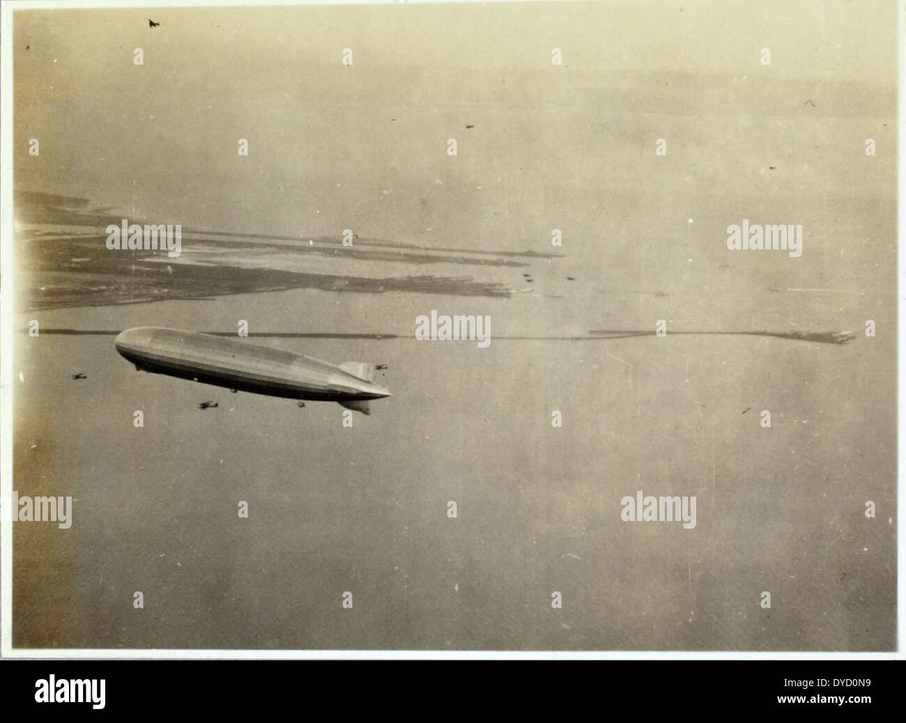 This image features the Graf Zeppelin LZ 127, a famous German dirigible ...