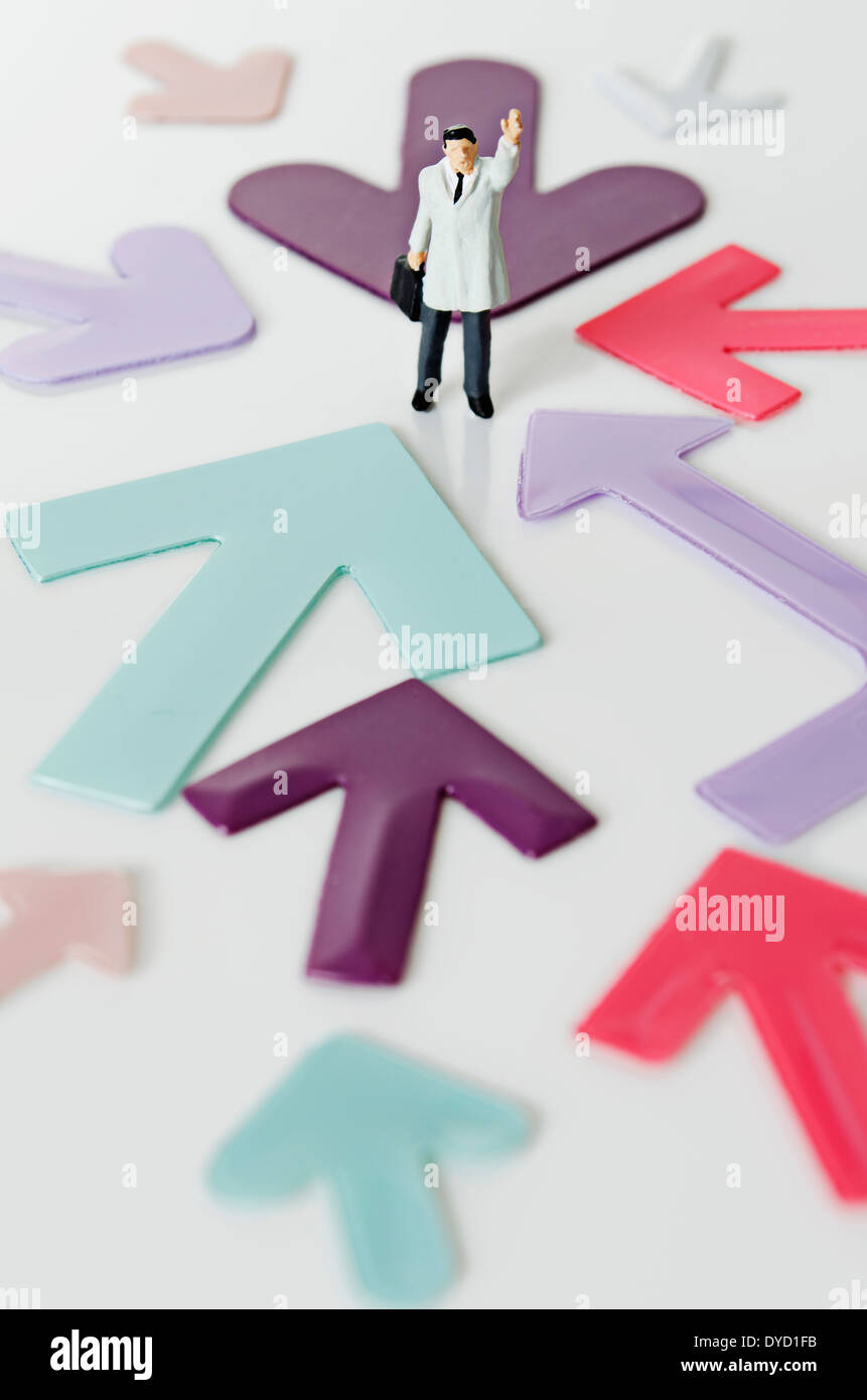 Business figurine with arm raised with arrows hi-res stock photography ...