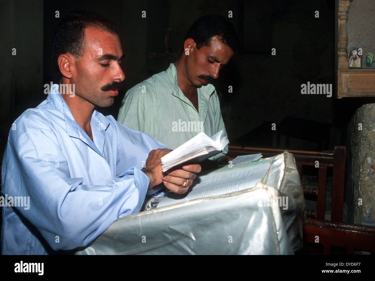 Two Coptic Christian men reading the bible, Egypt Stock Photo - Alamy