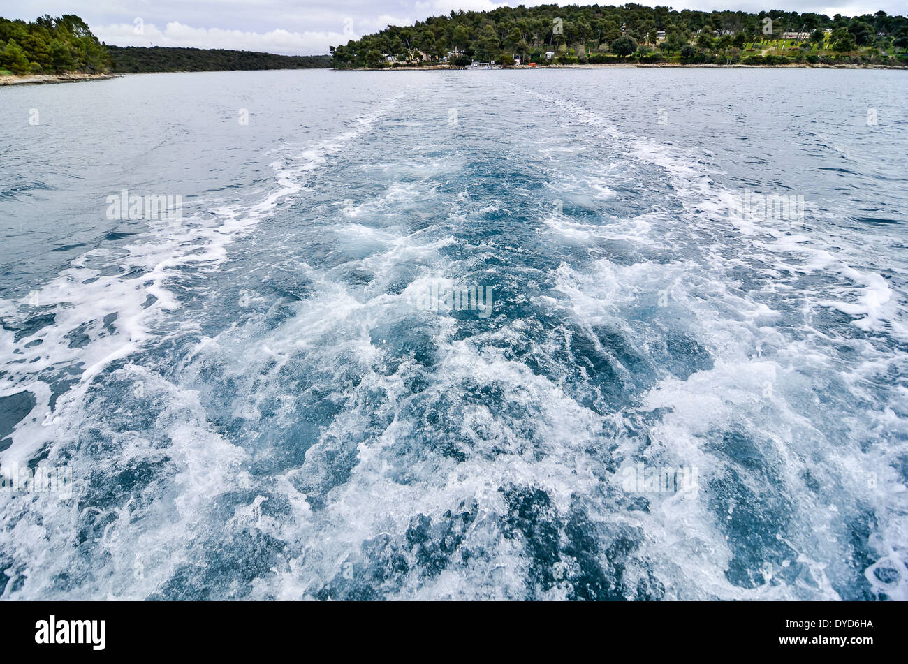 Boat is leaving an Island Stock Photo - Alamy