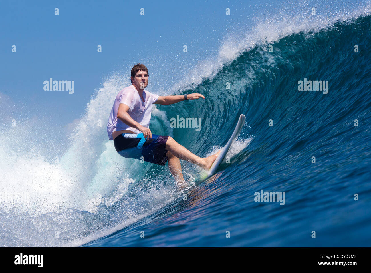 Surfing a wave Stock Photo - Alamy