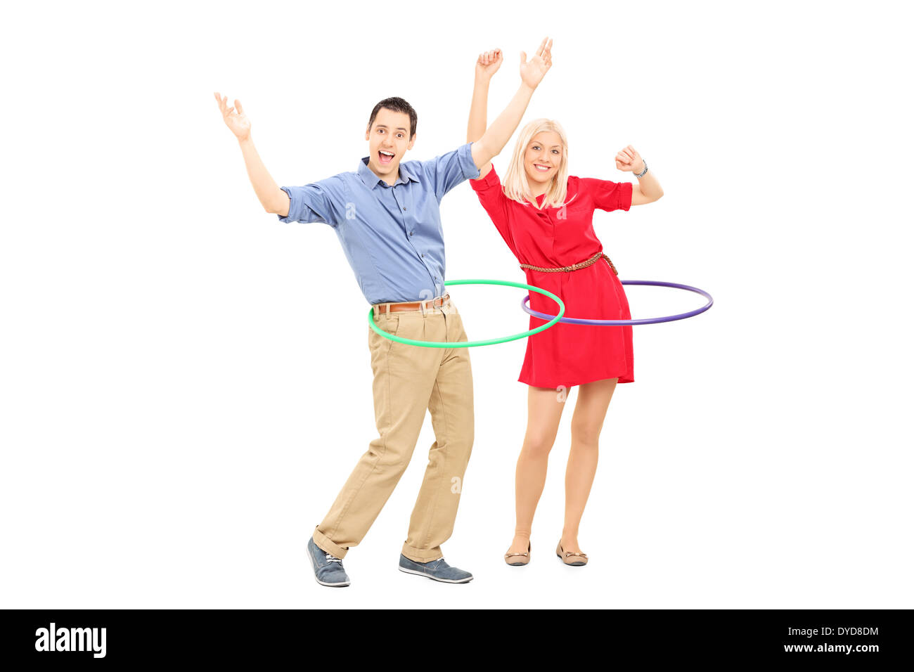 Happy man and woman exercising with hula hoop Stock Photo - Alamy