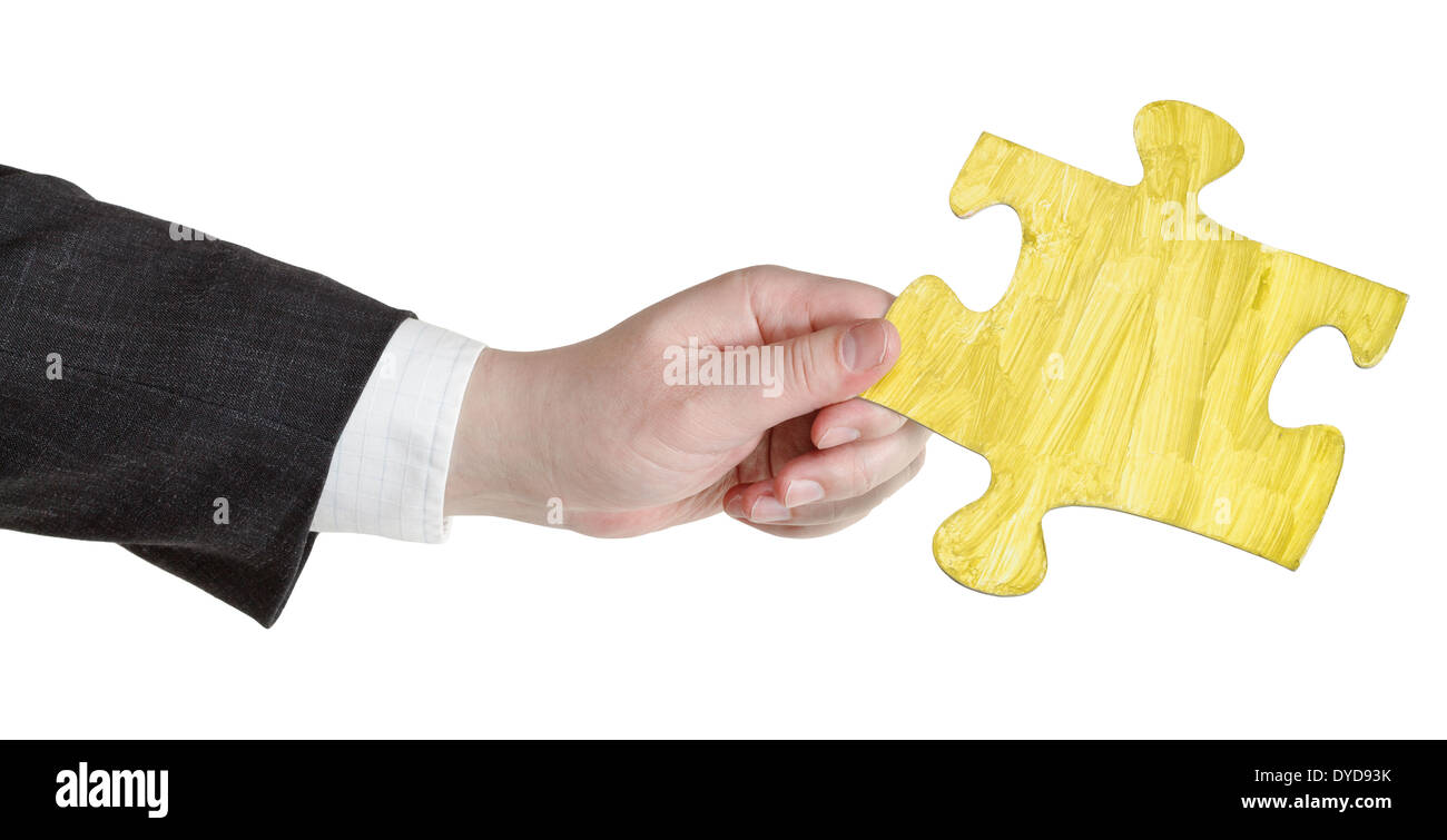 male hand with painted yellow puzzle piece isolated on white background ...